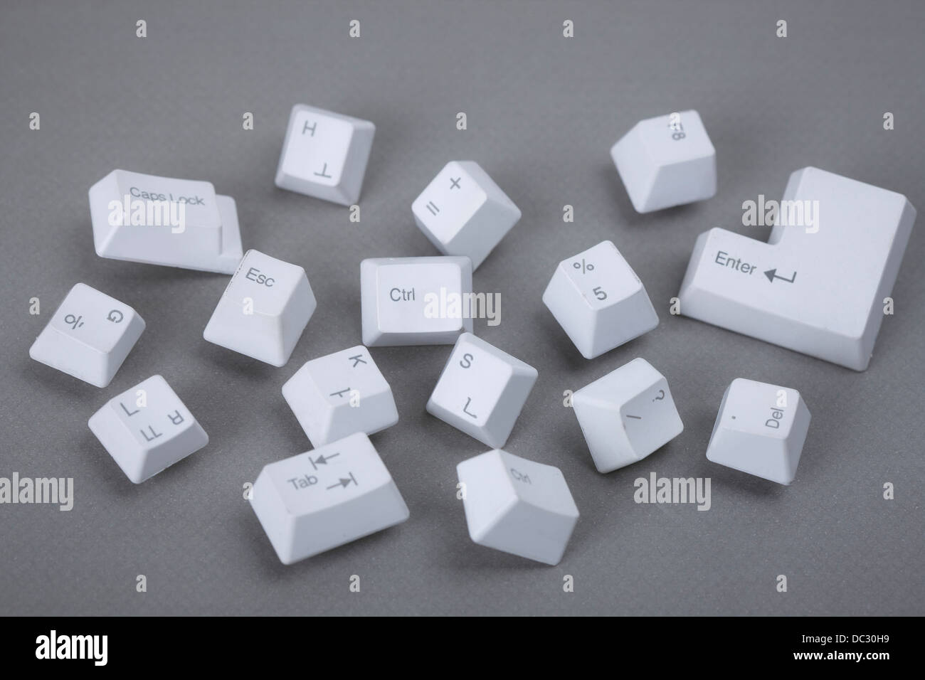 keyboard pieces on grey background Stock Photo - Alamy