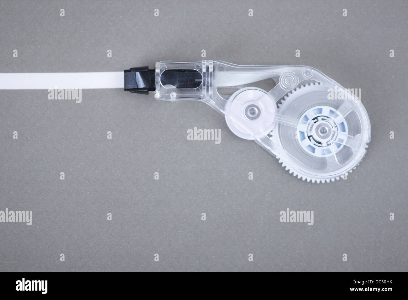 correction tape on grey background Stock Photo - Alamy