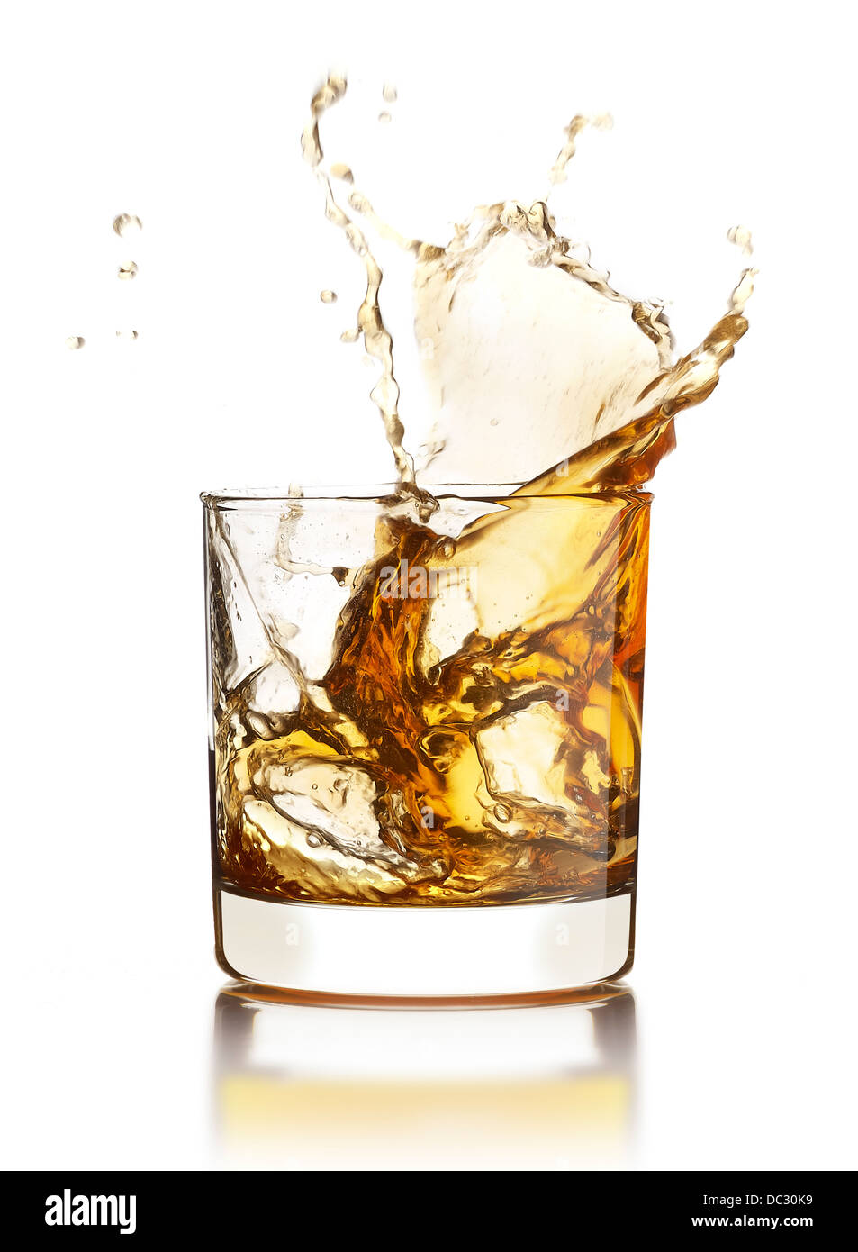 Whisky splashing out of the glass with ice cubes isolated on white with reflection Stock Photo ...