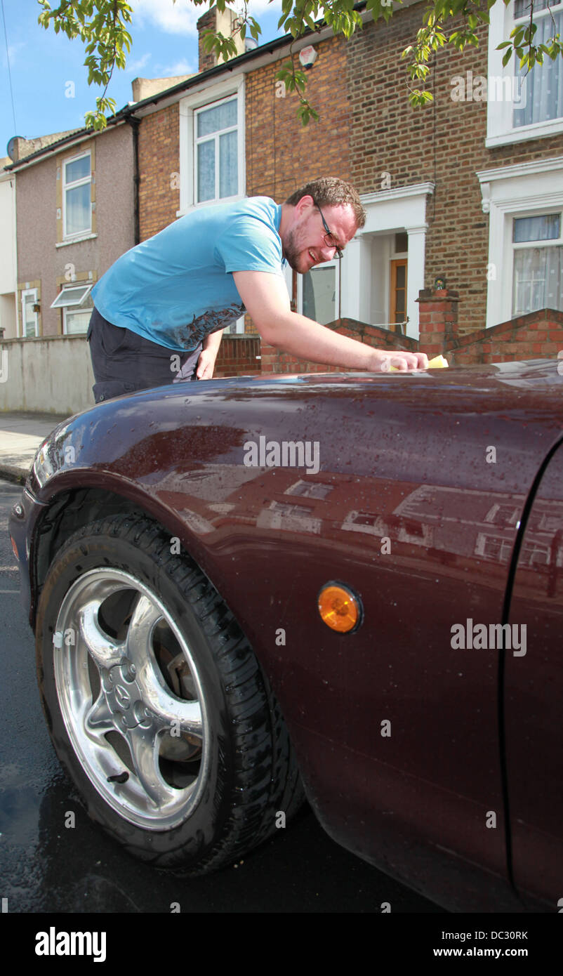 A man washing his car by hand, UK Stock Photo - Alamy