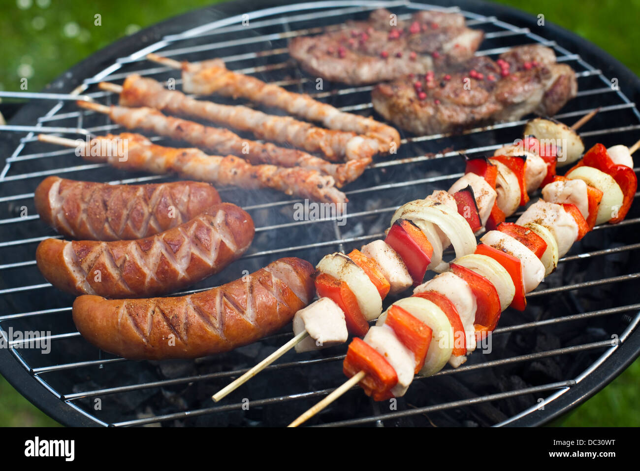 Closeup of meat on grill Stock Photo - Alamy