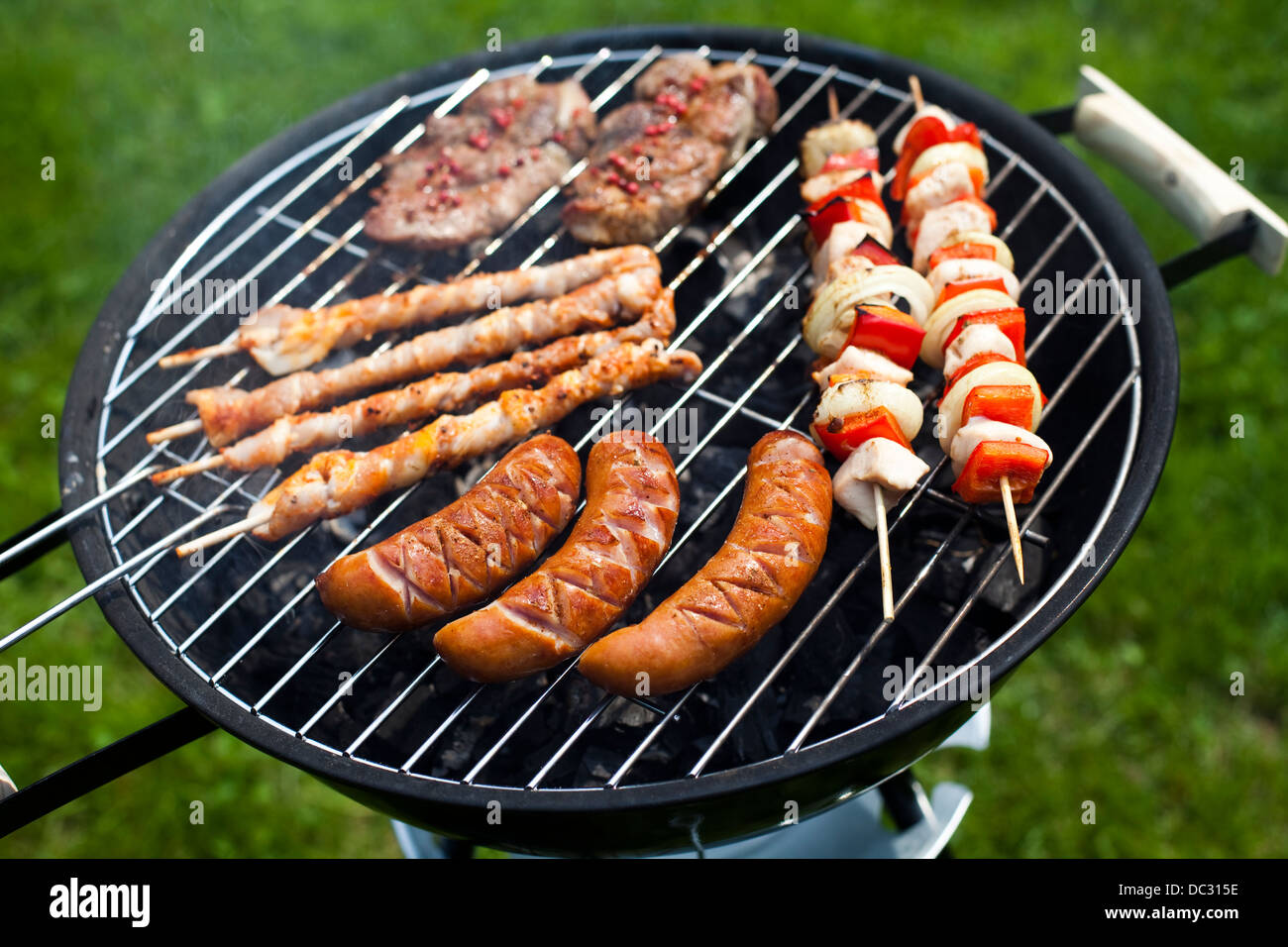 Closeup of meat on grill Stock Photo - Alamy