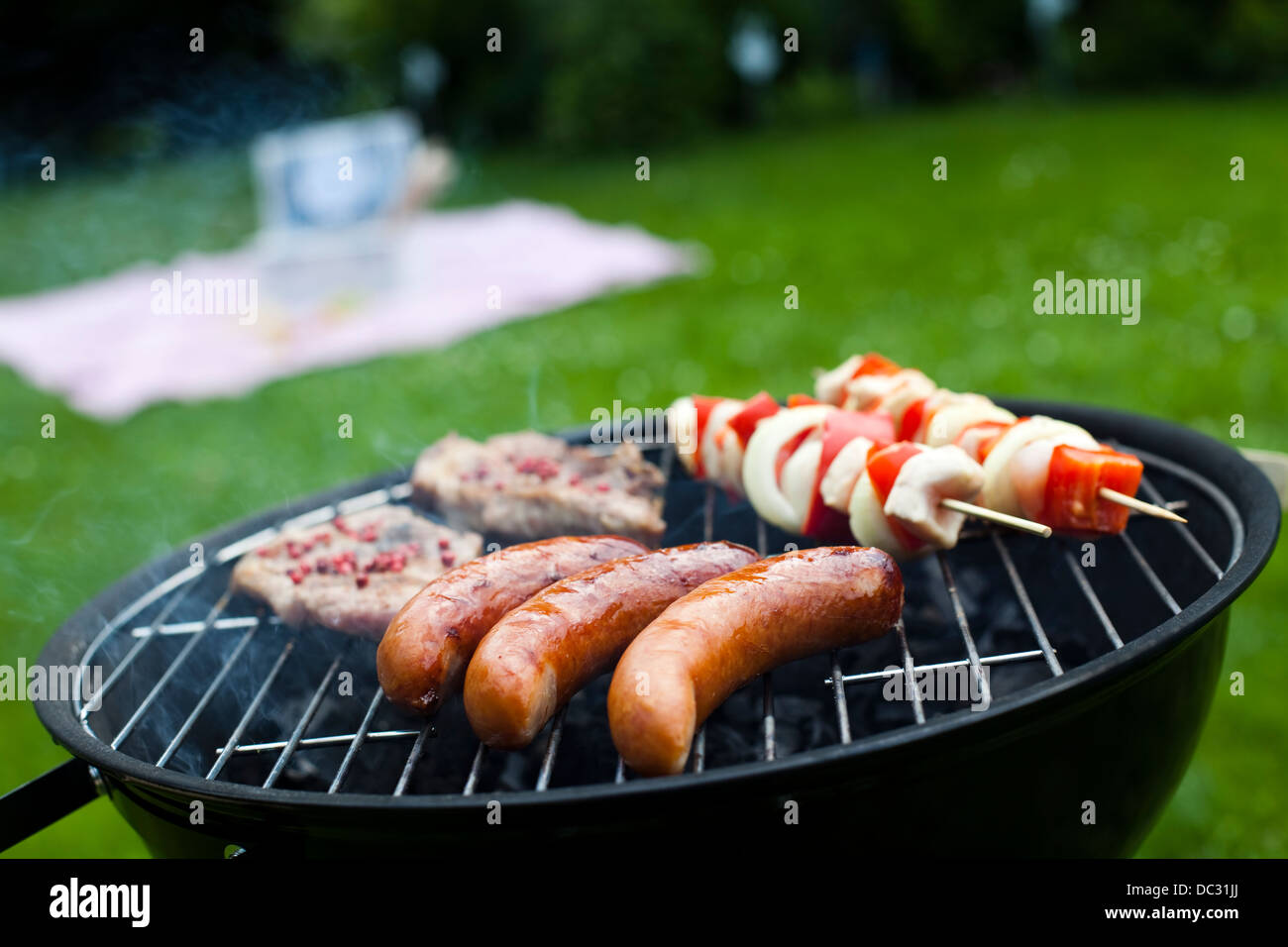 Cooking on the barbecue grill Stock Photo - Alamy