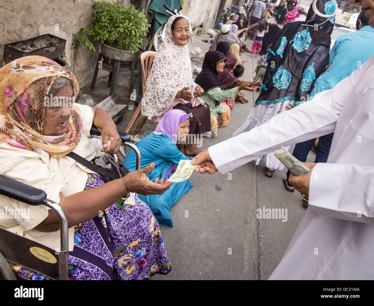 Bangkok, Thailand. 8th Aug, 2013. A man leaving Haroon Mosque for Eid ...