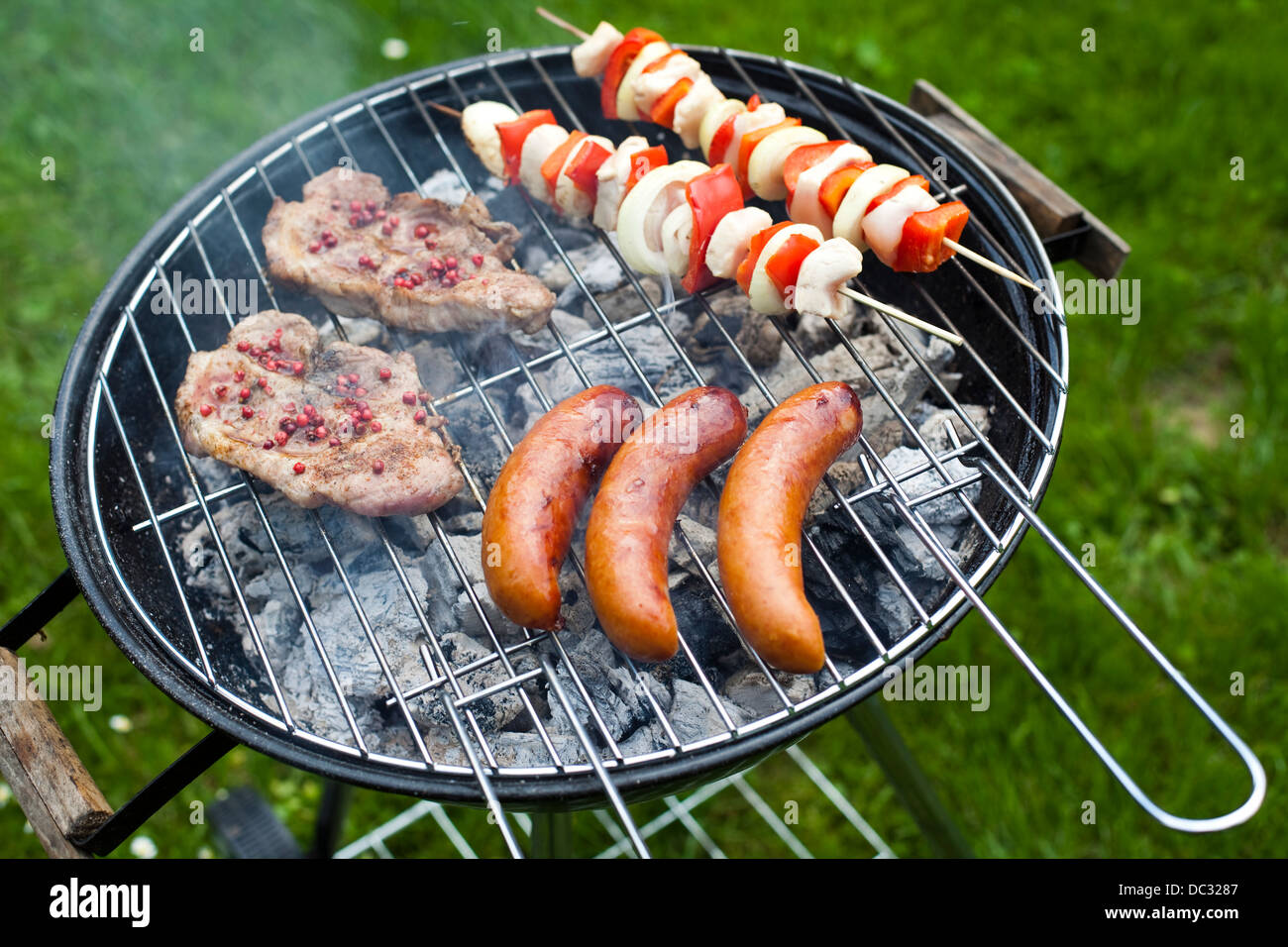 Cooking on the barbecue grill Stock Photo - Alamy
