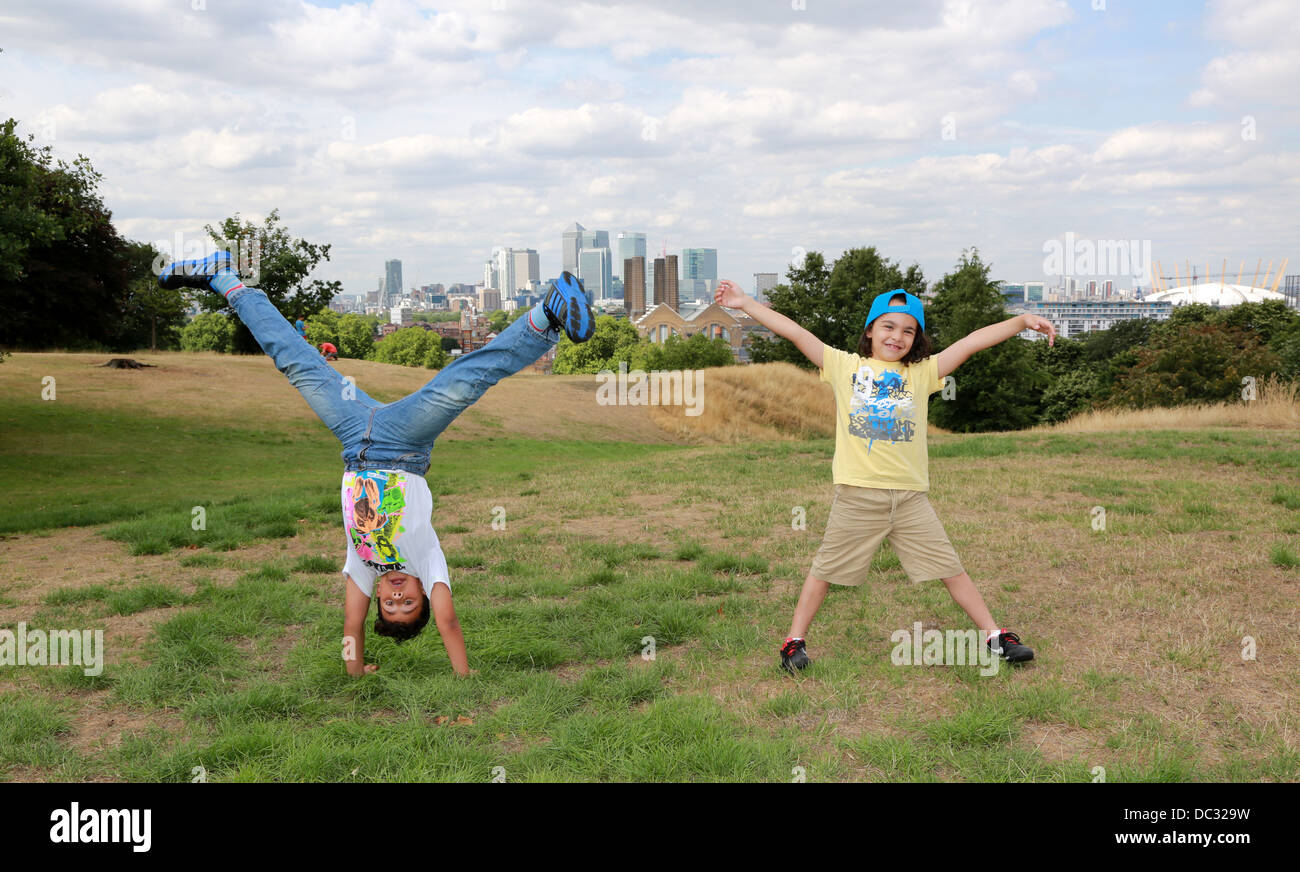 2 brothers doing handstands in the park Stock Photo - Alamy