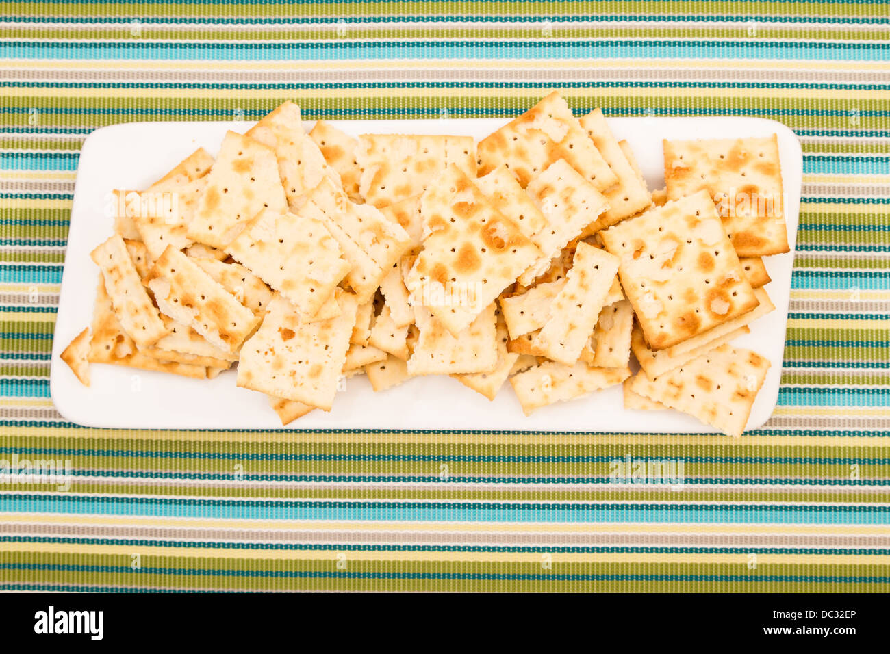 Lots of salted crackers, ones broken Stock Photo - Alamy
