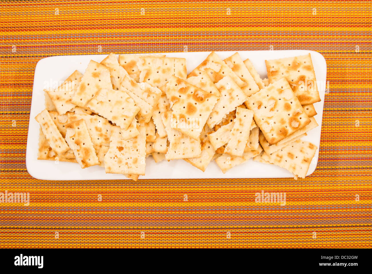 Lots of salted crackers, ones broken Stock Photo - Alamy