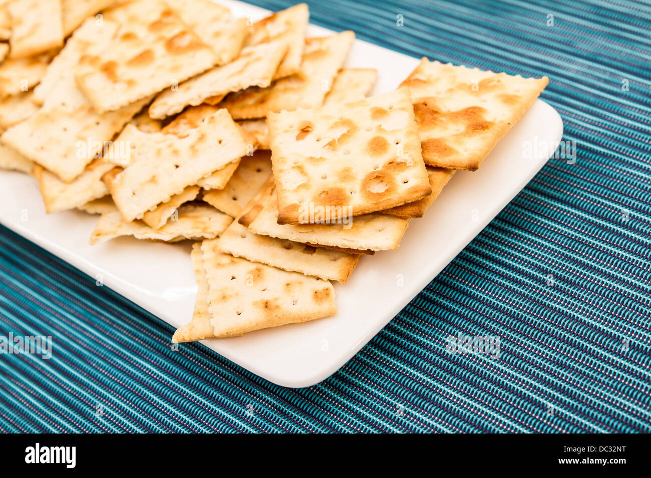 Lots of salted crackers, ones broken Stock Photo - Alamy