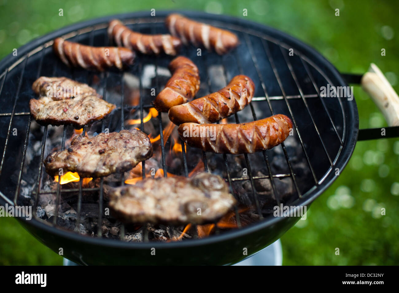 Cooking on the barbecue grill Stock Photo - Alamy