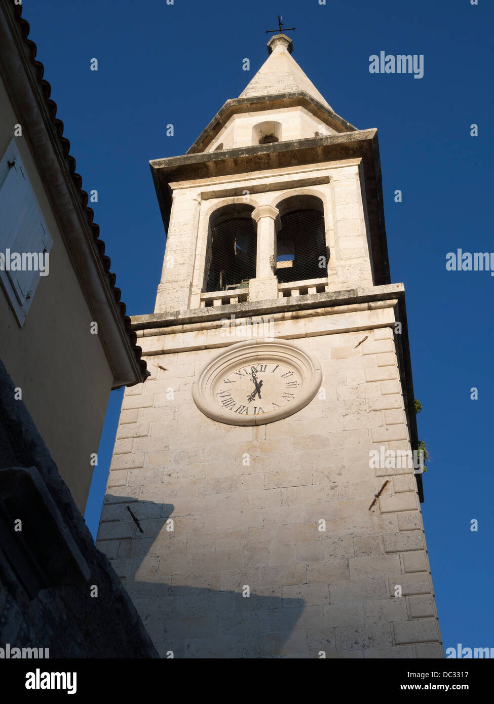 bell tower of St.John cathedral in Budva Montenegro just before sundown ...