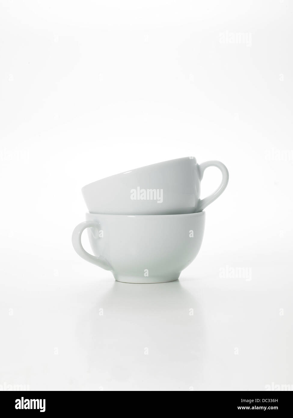 Two cups on white background Stock Photo - Alamy