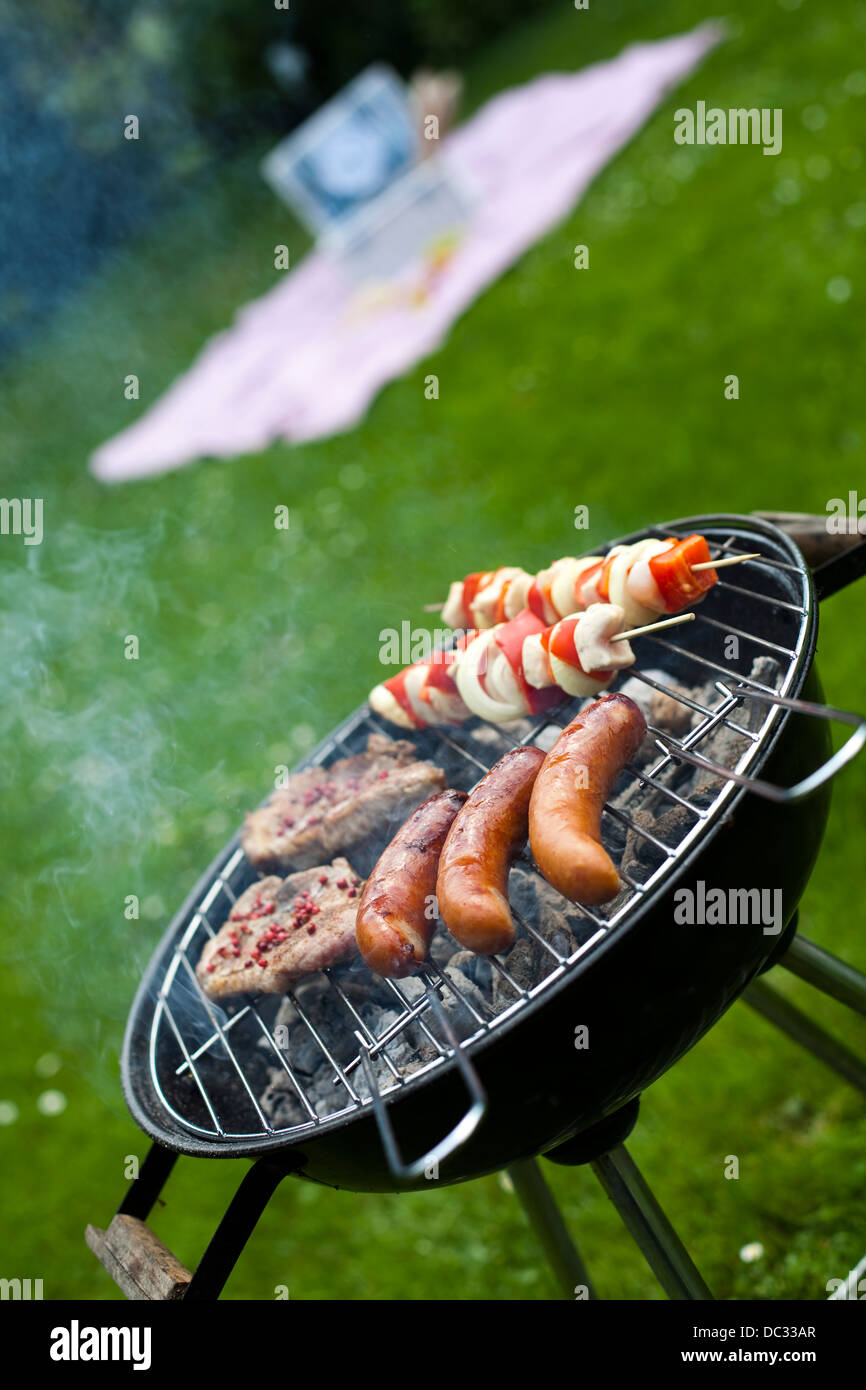 Cooking on the barbecue grill Stock Photo - Alamy