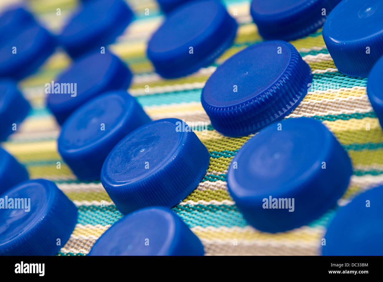 Many plastic blue lids Stock Photo - Alamy