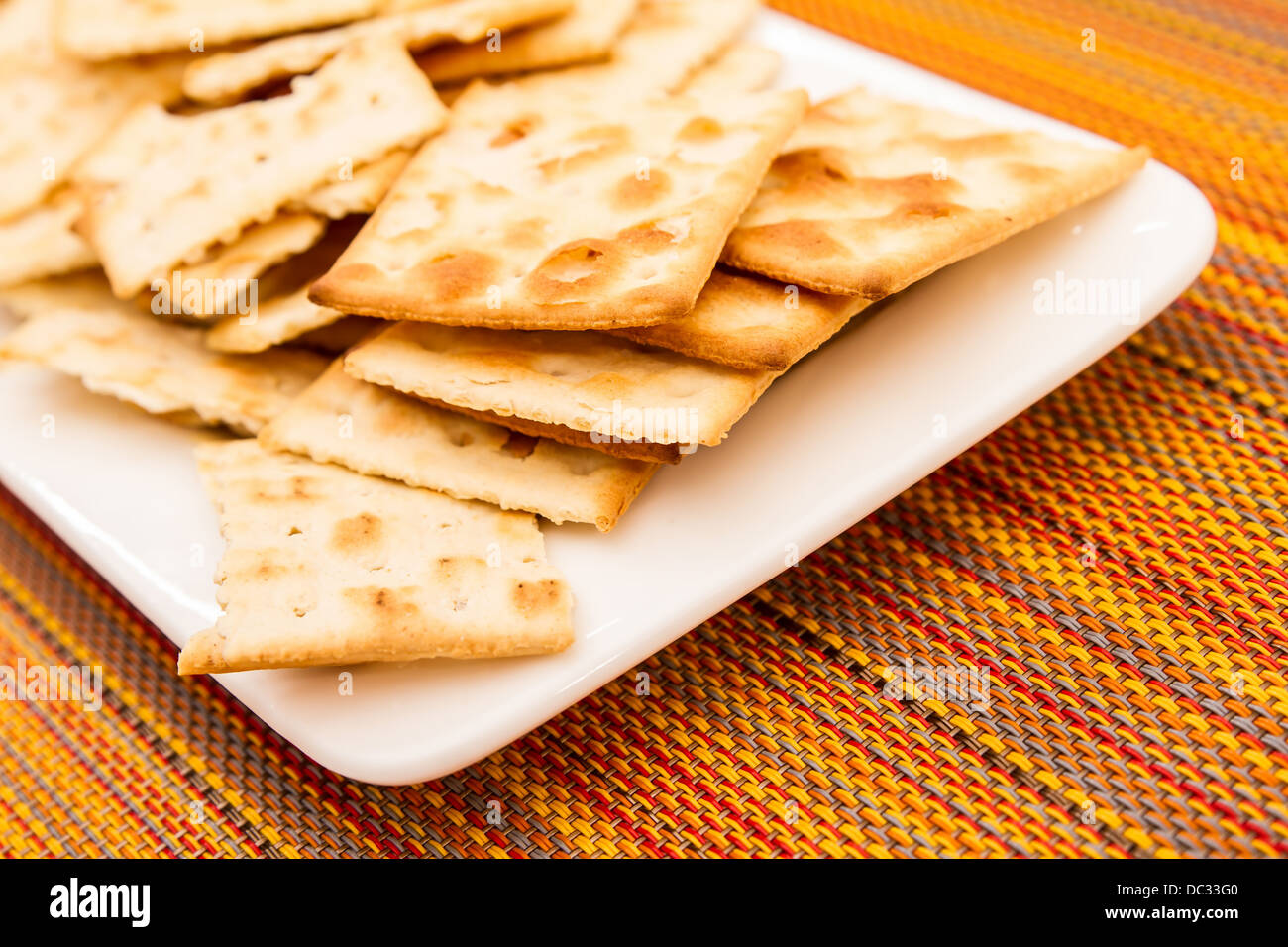 Lots of salted crackers, ones broken Stock Photo - Alamy