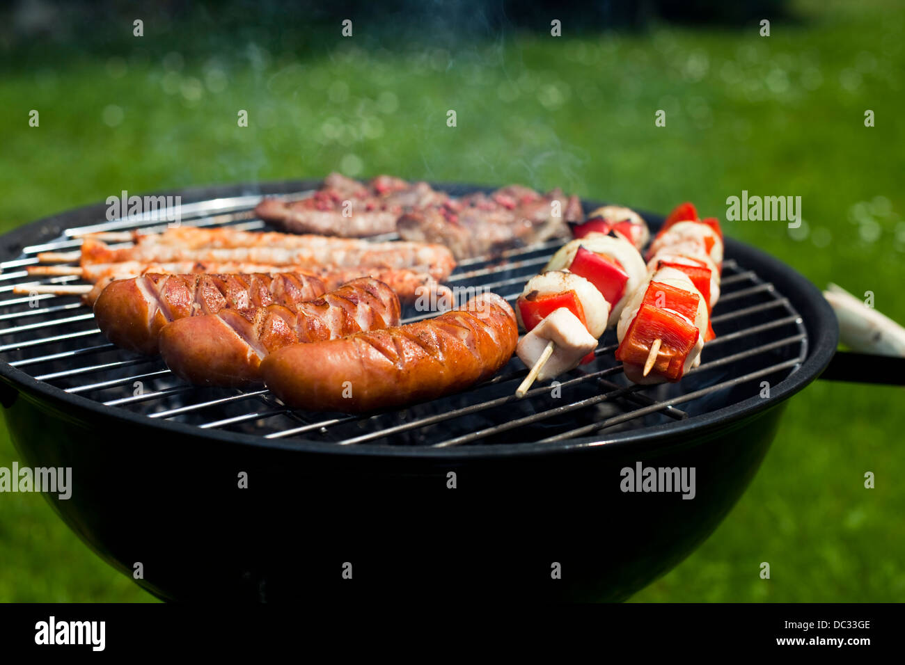 Cooking on the barbecue grill Stock Photo - Alamy