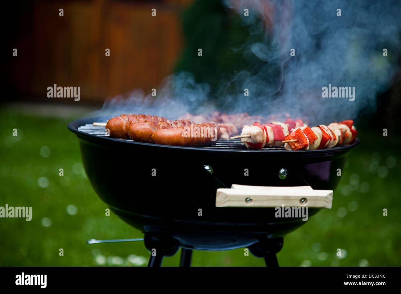Cooking on the barbecue grill Stock Photo - Alamy