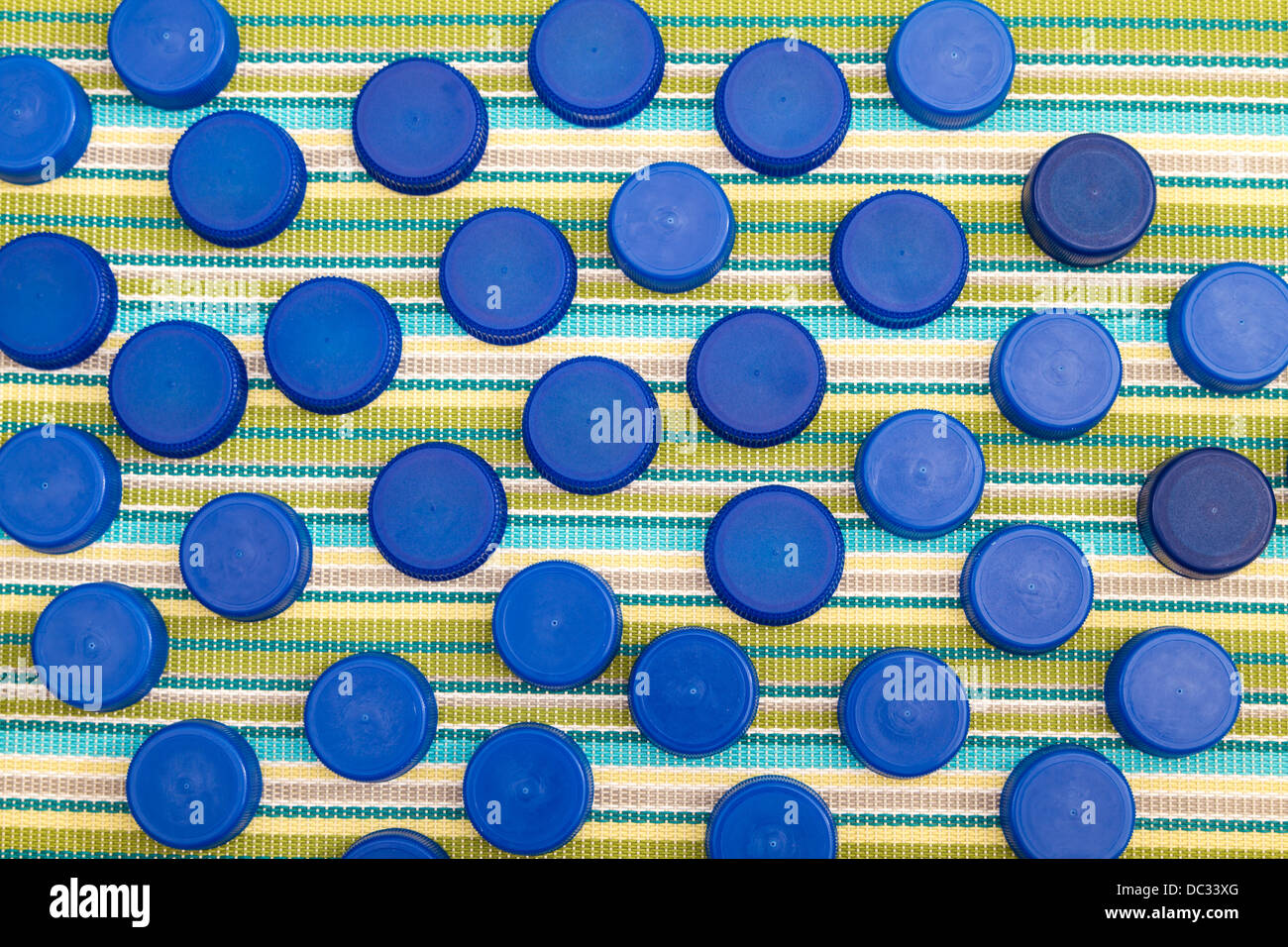 Many plastic blue lids background Stock Photo - Alamy