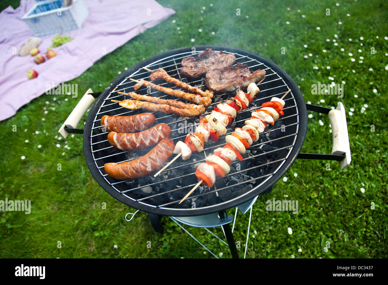 Cooking on the barbecue grill Stock Photo - Alamy