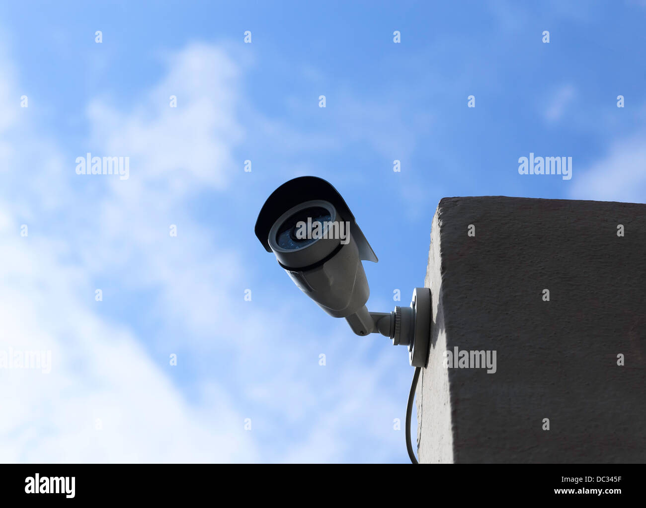 cctv on the wall with blue sky Stock Photo - Alamy