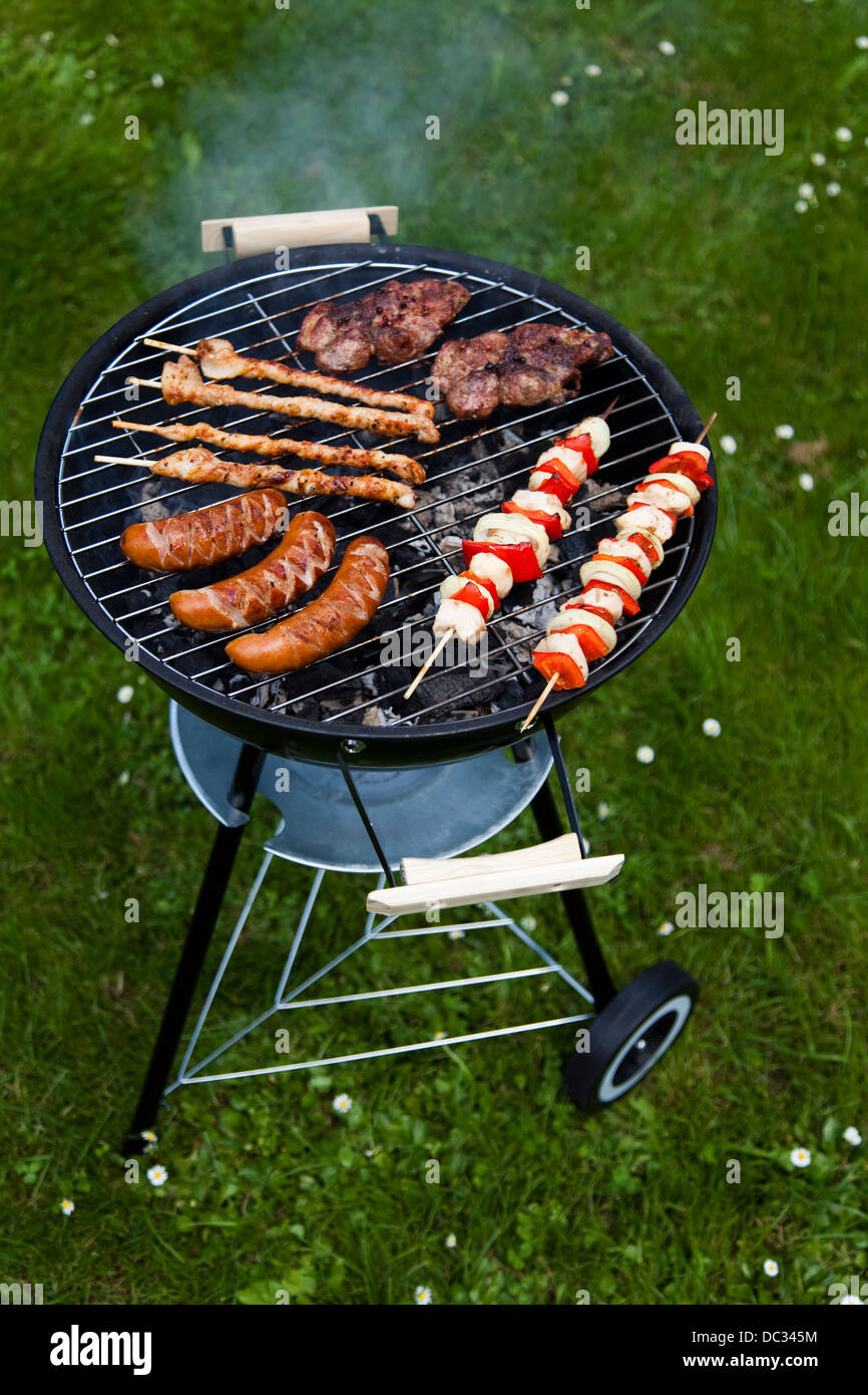 Cooking on the barbecue grill Stock Photo - Alamy