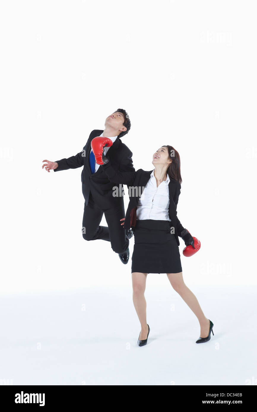 businesswoman beating up businessman Stock Photo - Alamy