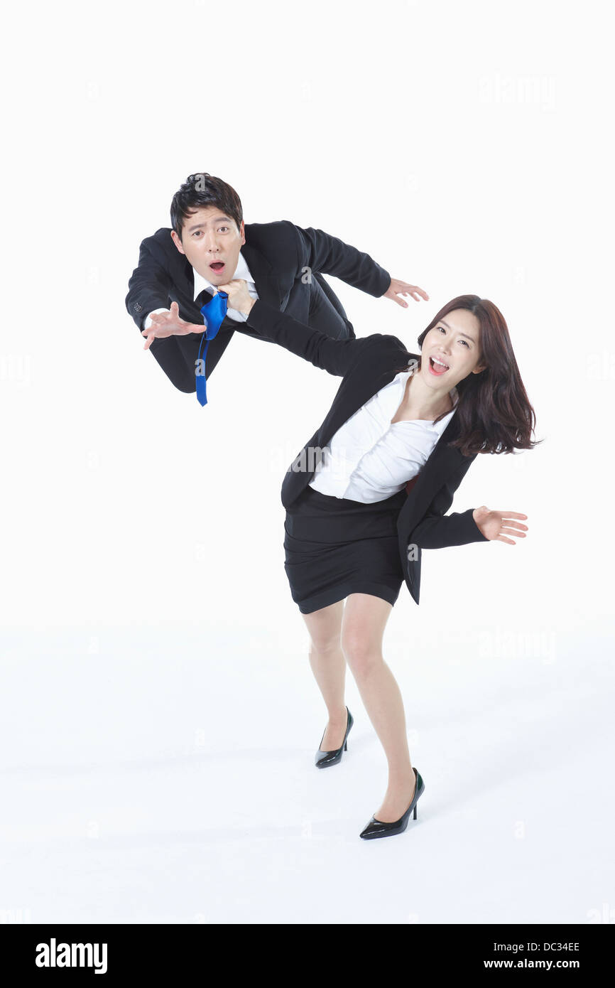 businesswoman beating up businessman Stock Photo - Alamy