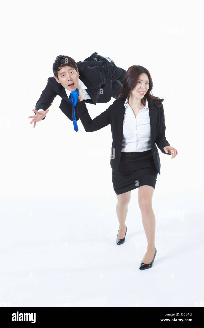businesswoman beating up businessman Stock Photo - Alamy