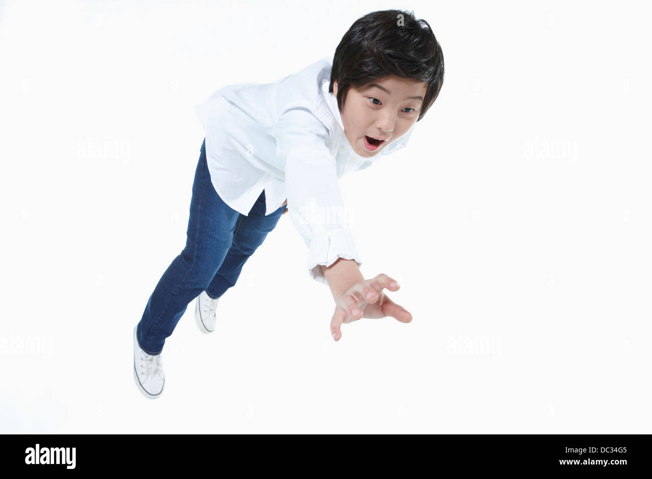 kid with jeans flying in the air Stock Photo - Alamy
