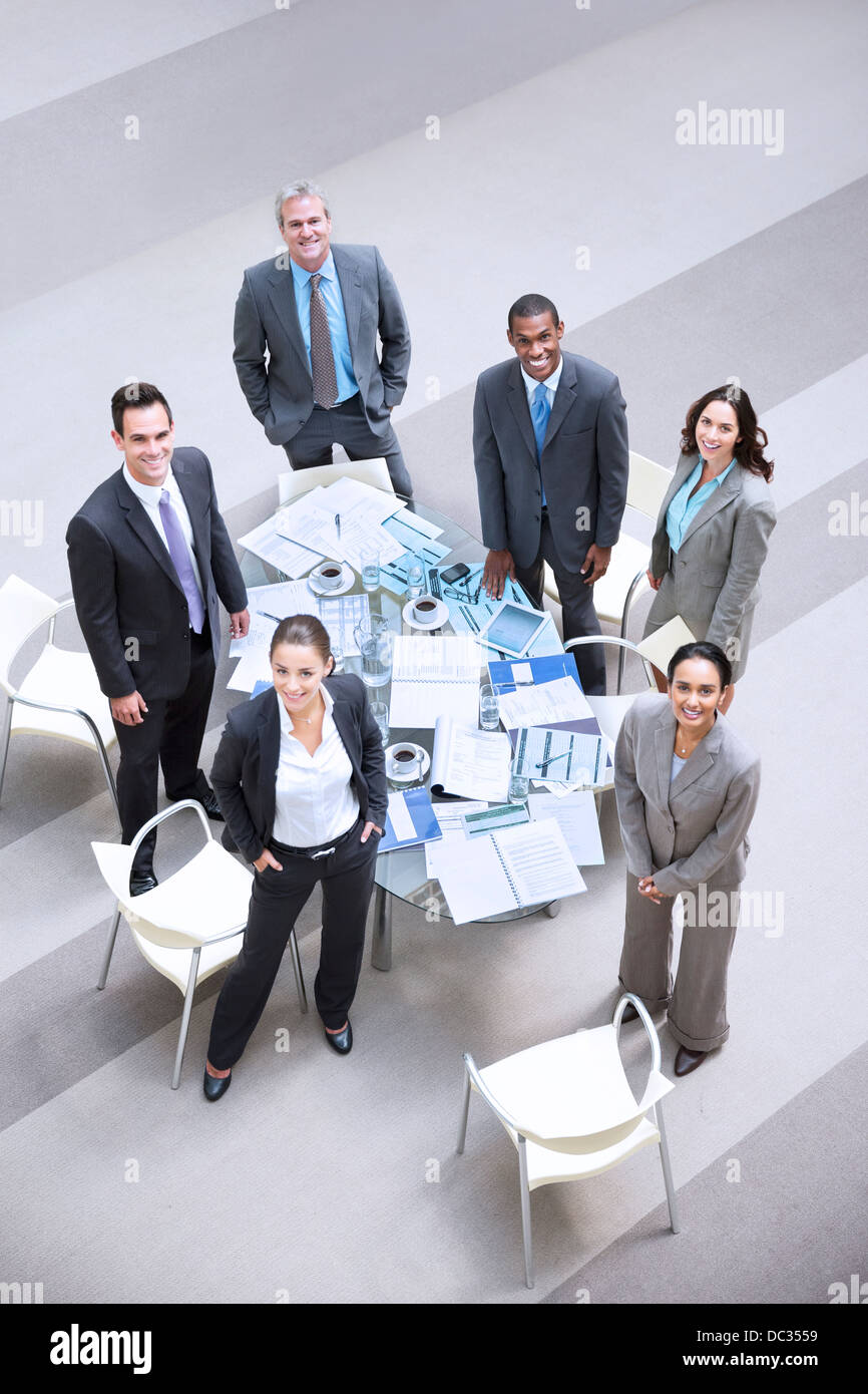 High angle portrait of smiling business people at table Stock Photo - Alamy