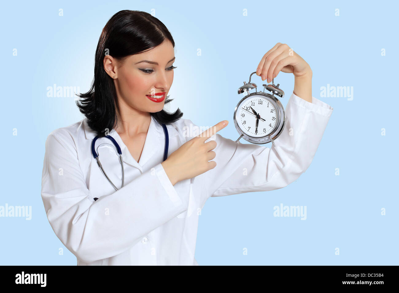 Young female doctor with clocks Stock Photo - Alamy