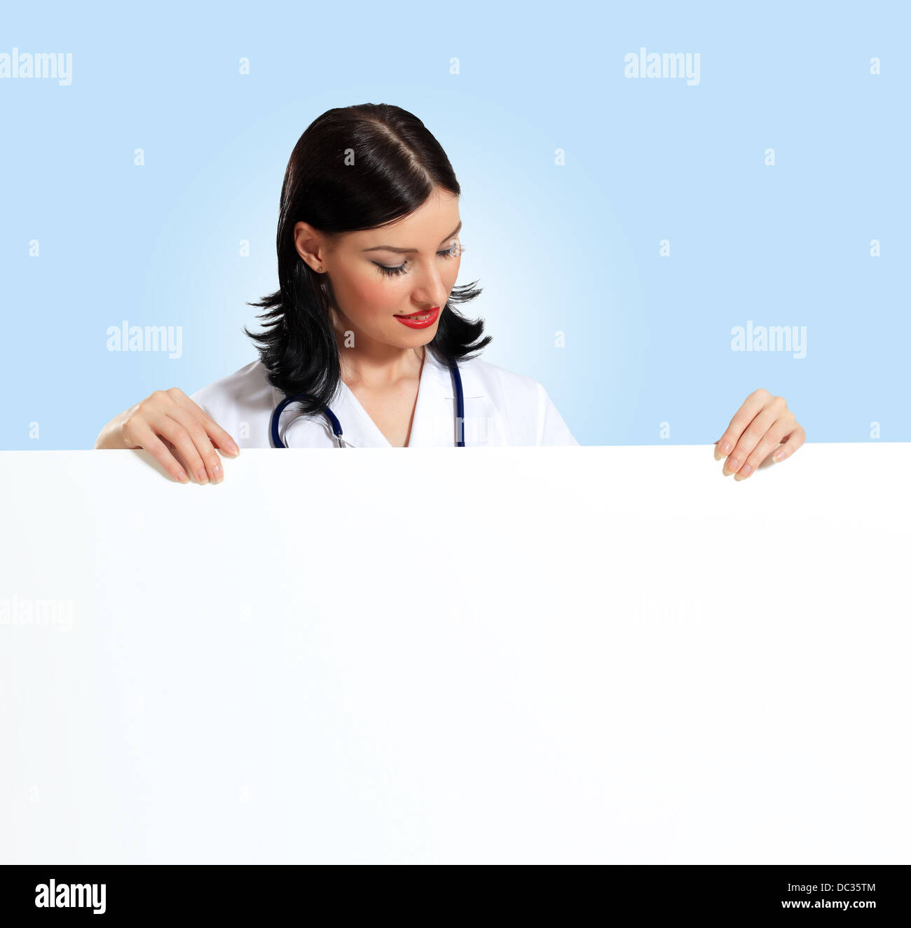 Young female doctor with a banner Stock Photo - Alamy