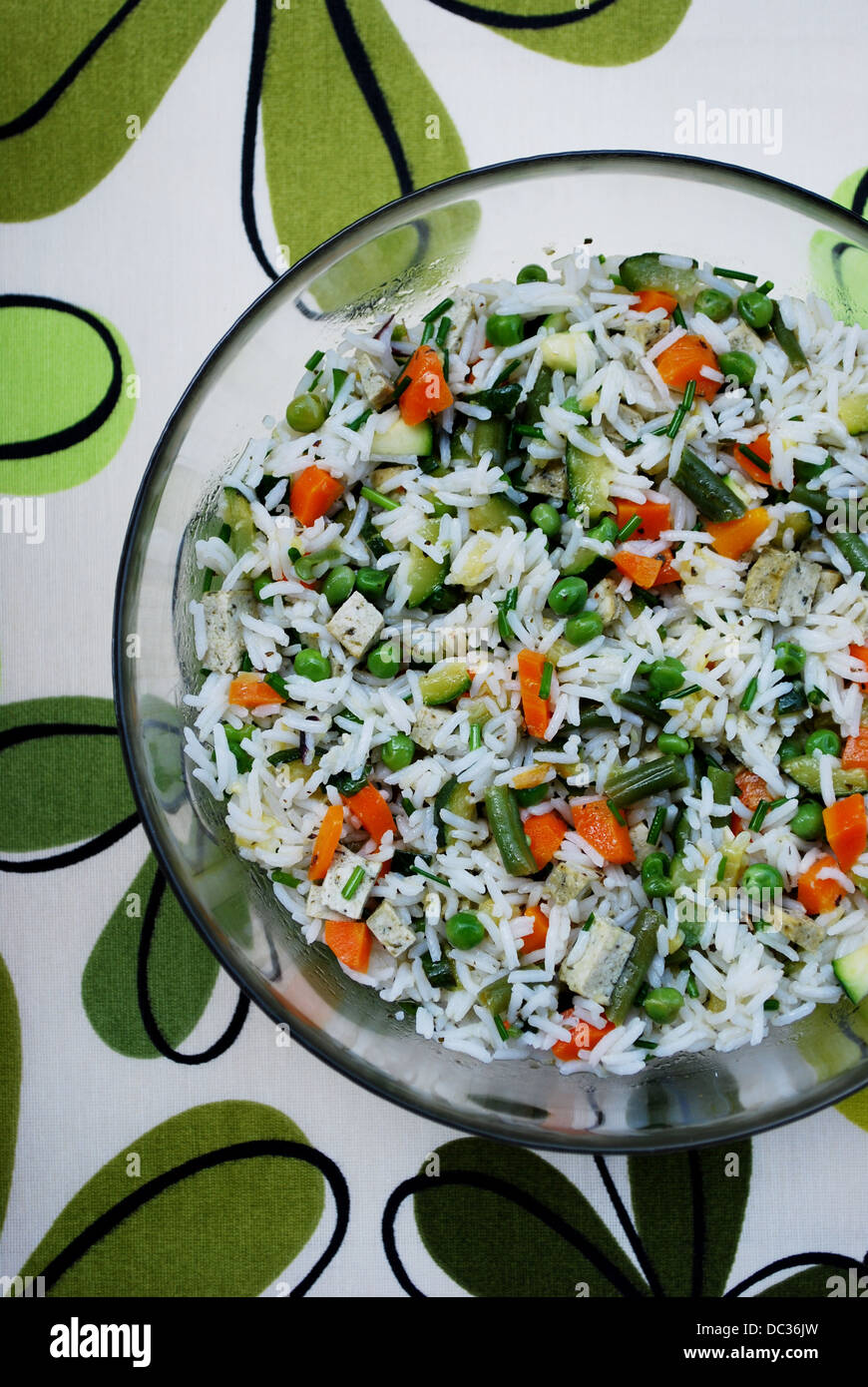 Vegetarian salad of white rice with mixed vegetables and tofu in a ...