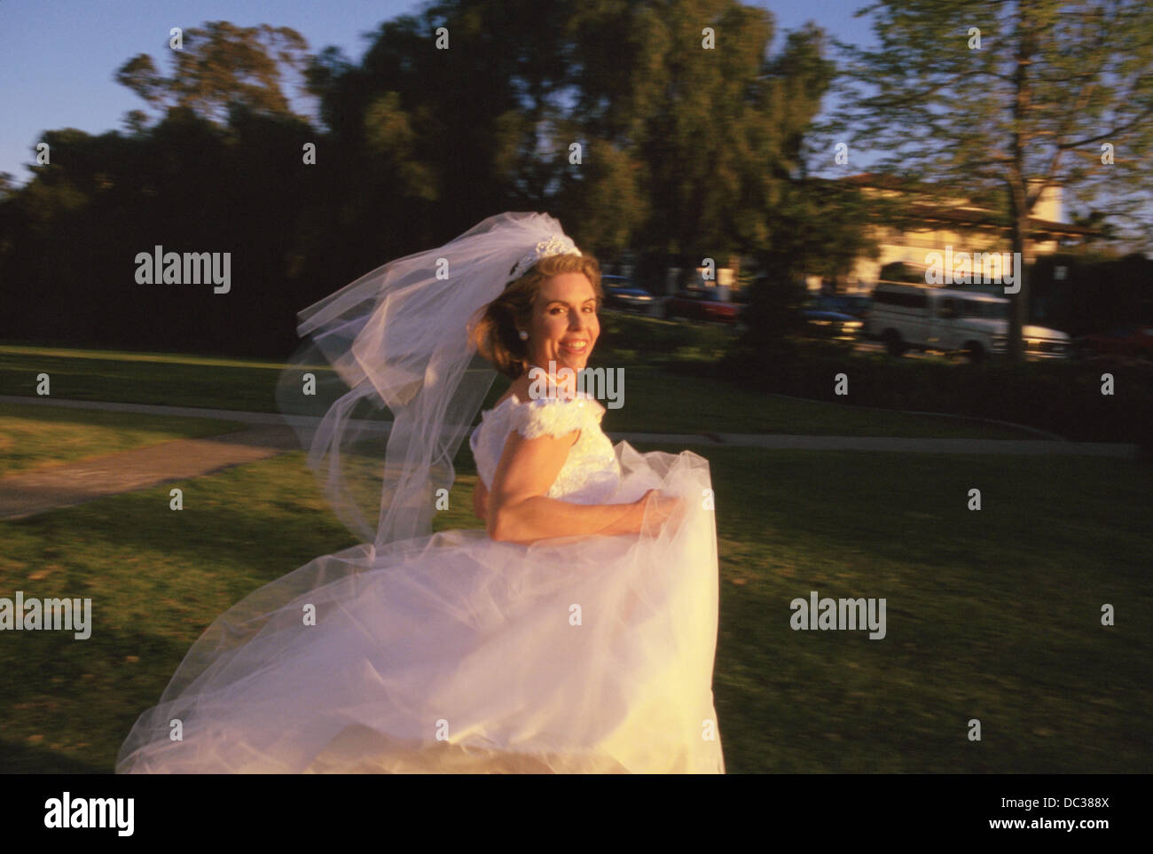 Happy bride running Stock Photo - Alamy