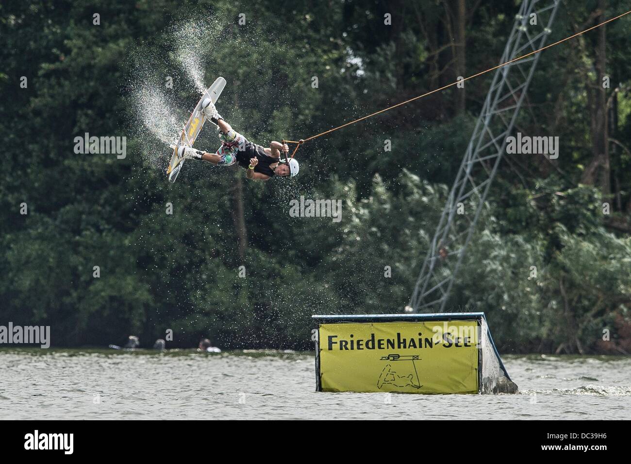 Wakeboarder Levin skies over the water on his wakeboard on Friedenhain ...
