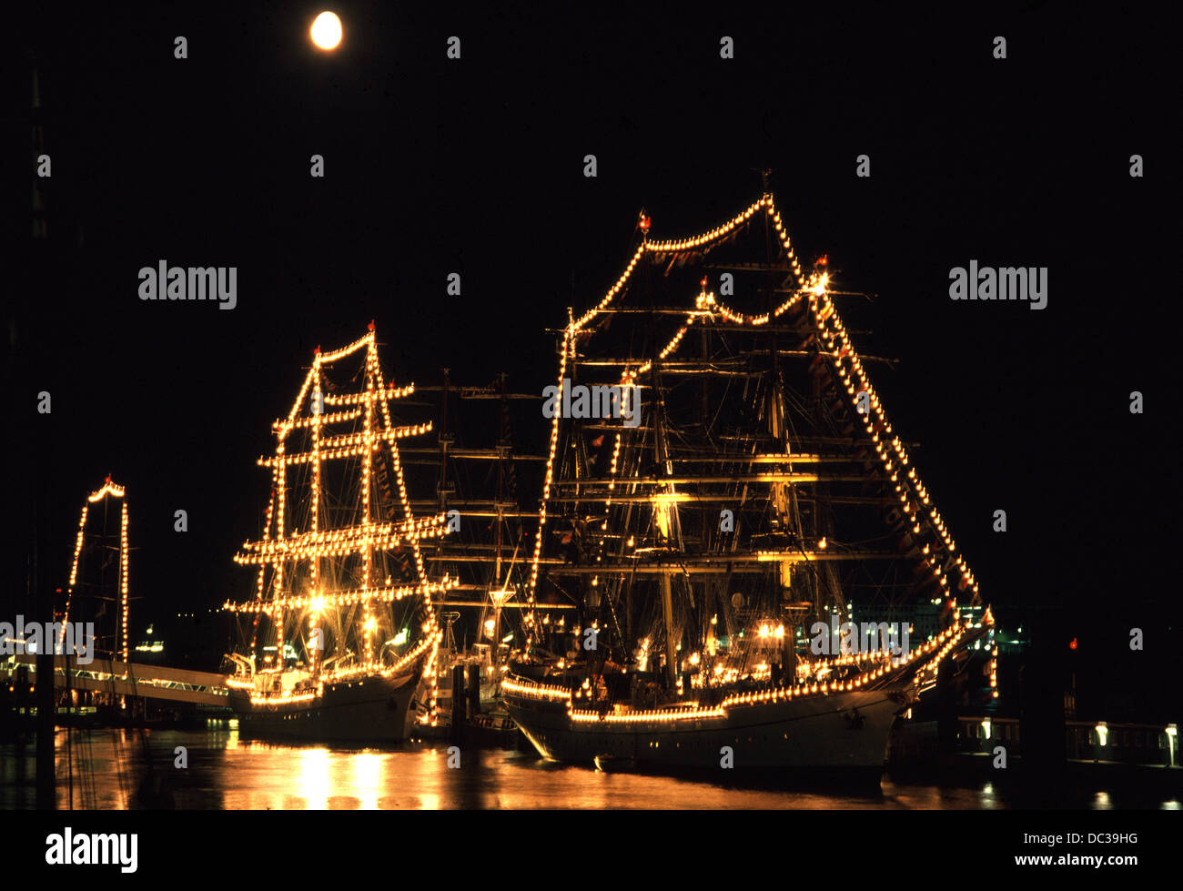 sailing ships with lights Stock Photo - Alamy