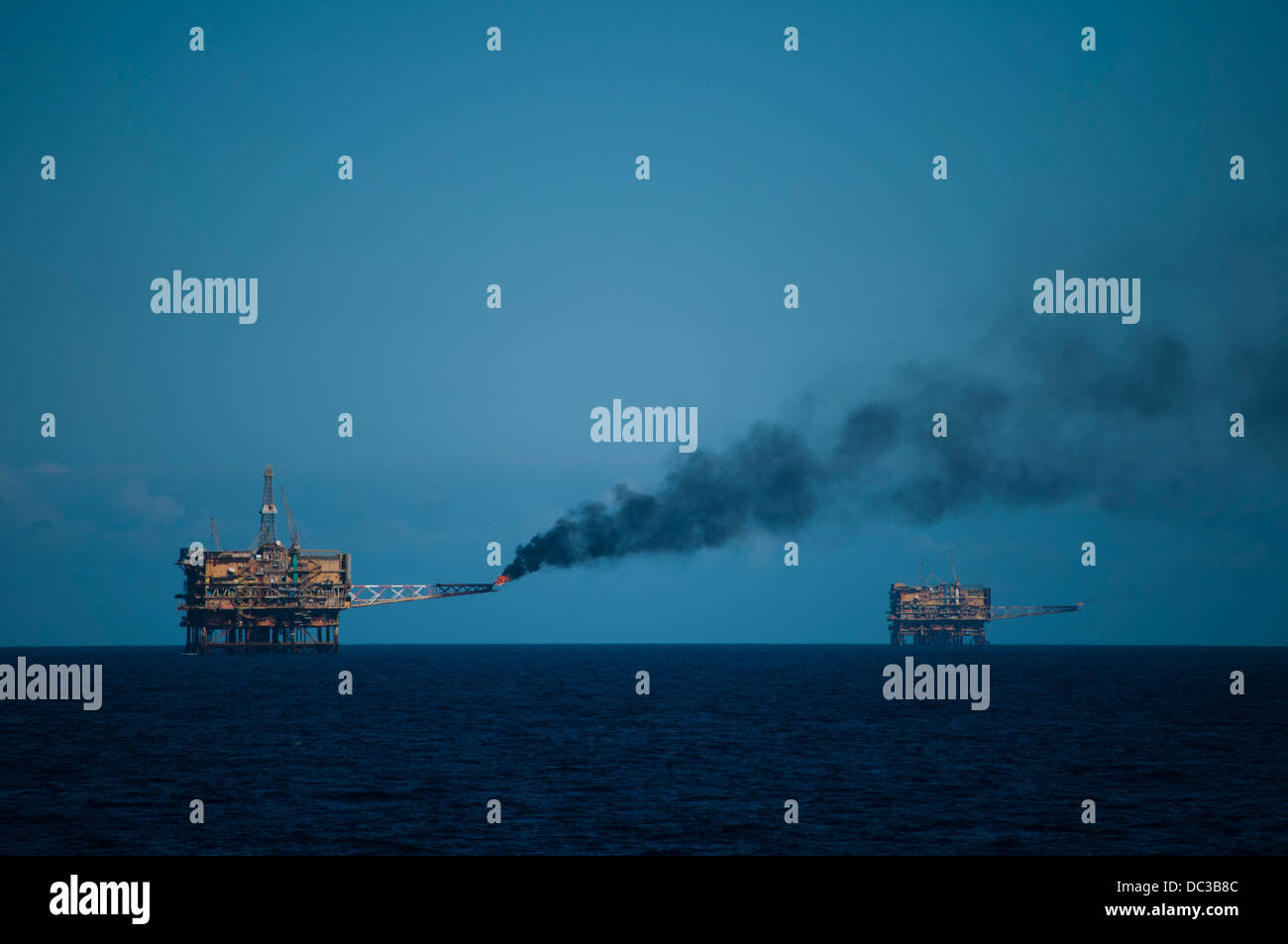 two shallow water oil rigs offshore Rio de Janeiro, sending smoke to ...