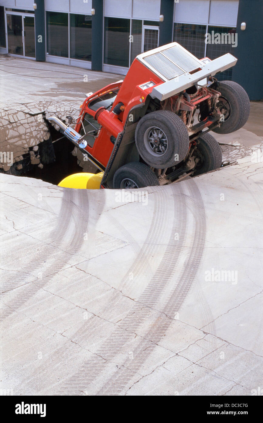 Truck in hole Stock Photo - Alamy