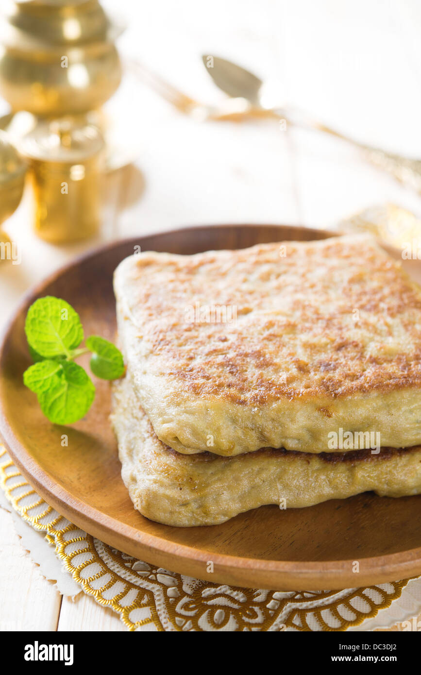 Martabak or murtabak, also mutabbaq, is a stuffed pancake or pan-fried ...
