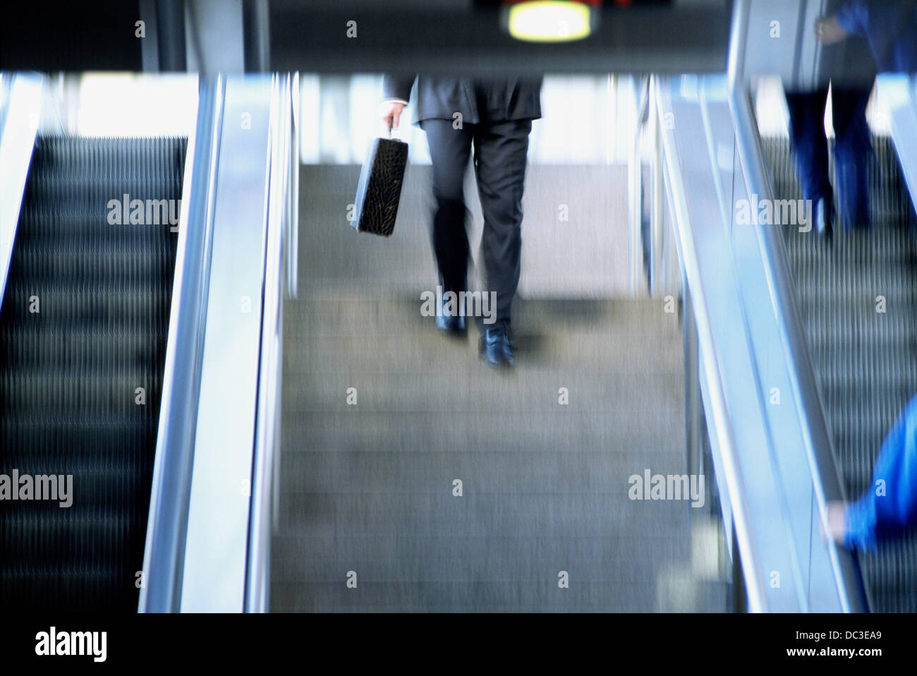 Business man walking upstairs Stock Photo - Alamy