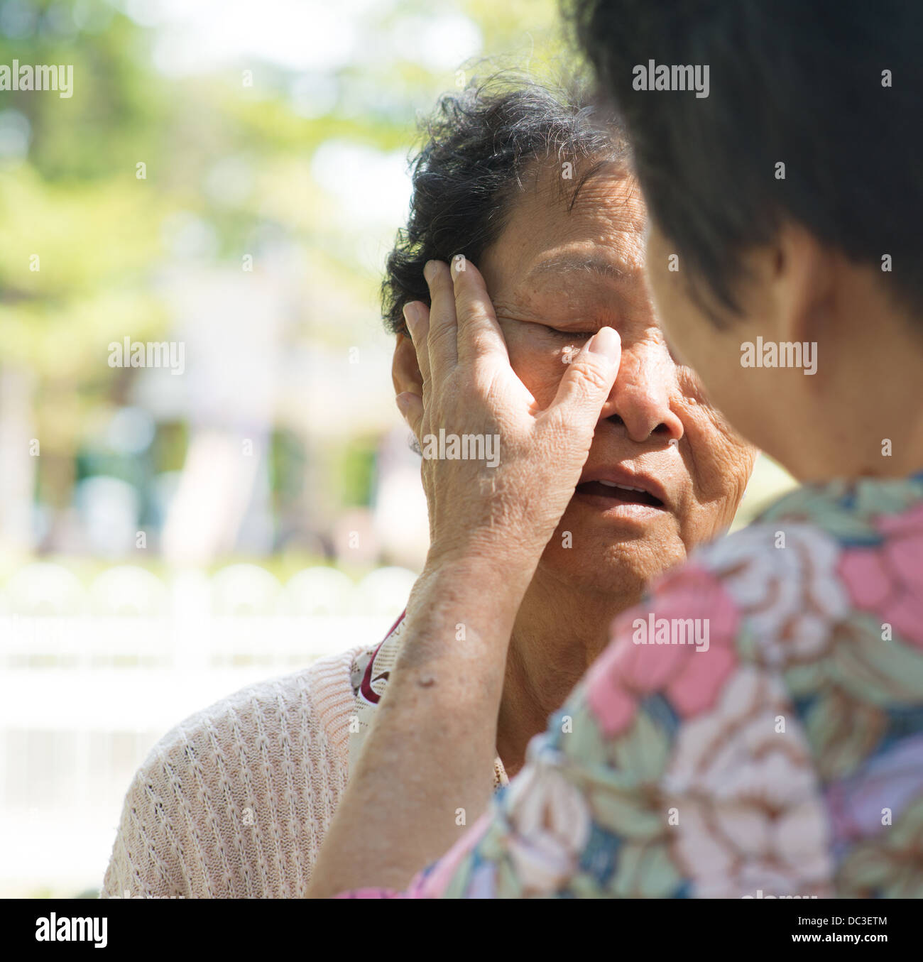 Mature woman comforting crying daughter hi-res stock photography and ...