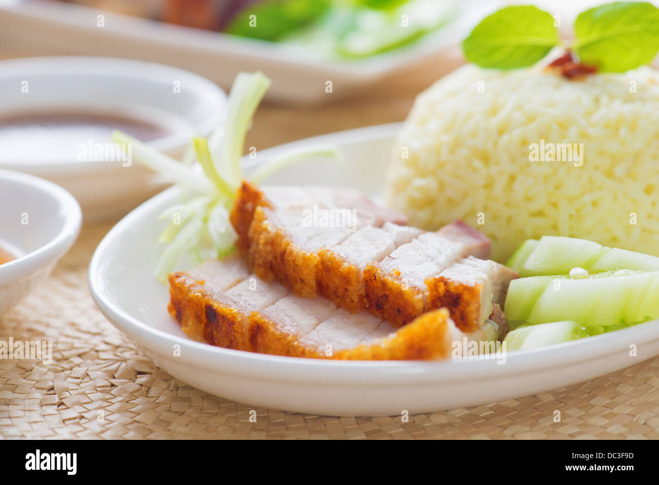 Siu Yuk or crispy roasted belly pork Chinese style, served with steamed ...