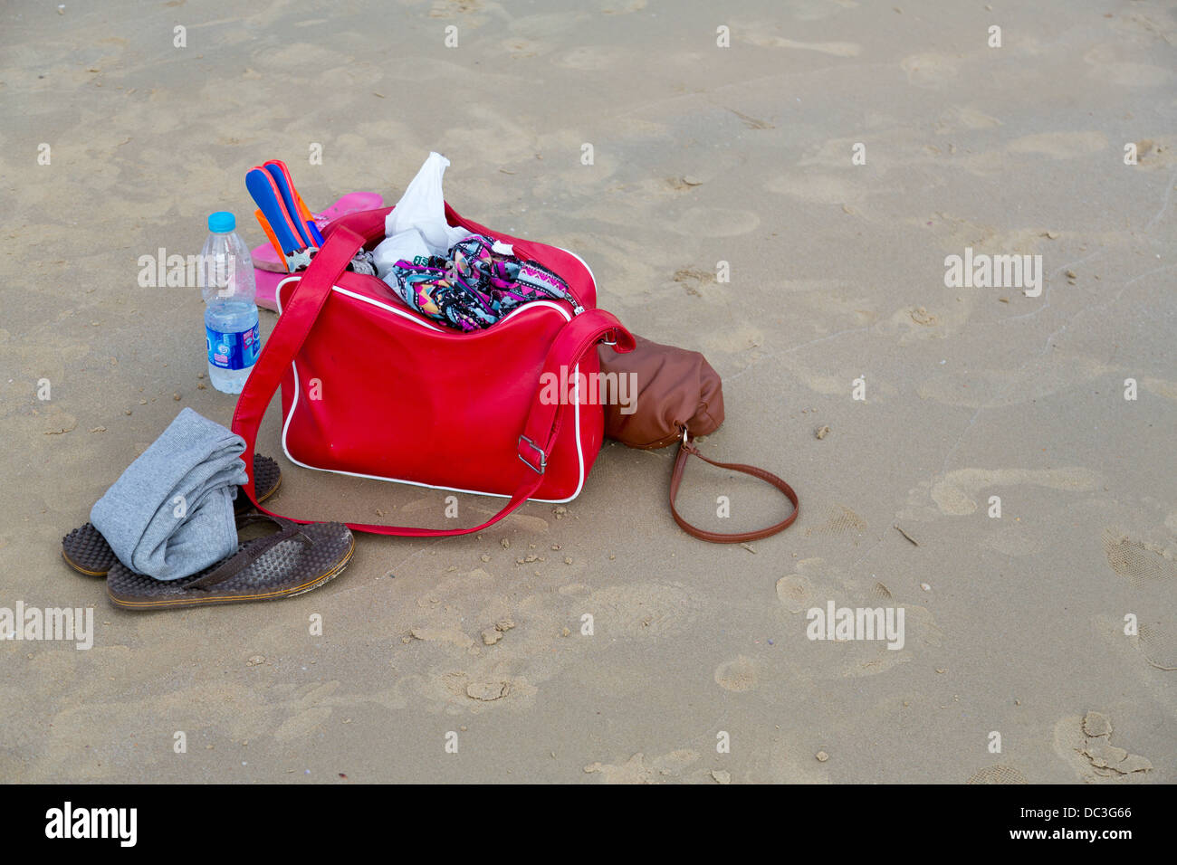Red Bag on the Beach in Ao Nang, Thailand Stock Photo - Alamy