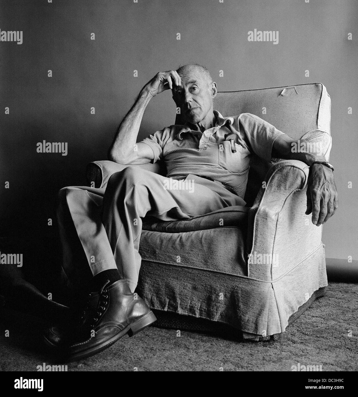 Skinny man sitting Black and White Stock Photos & Images - Alamy
