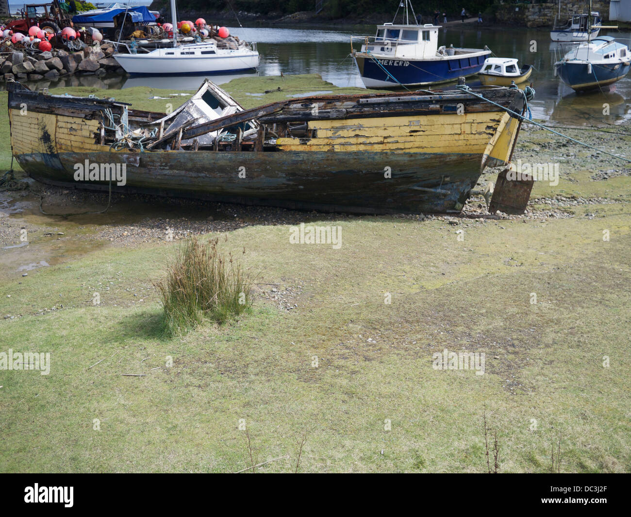 Old carvel built wooden fishing boat badly damaged in a recent storm ...