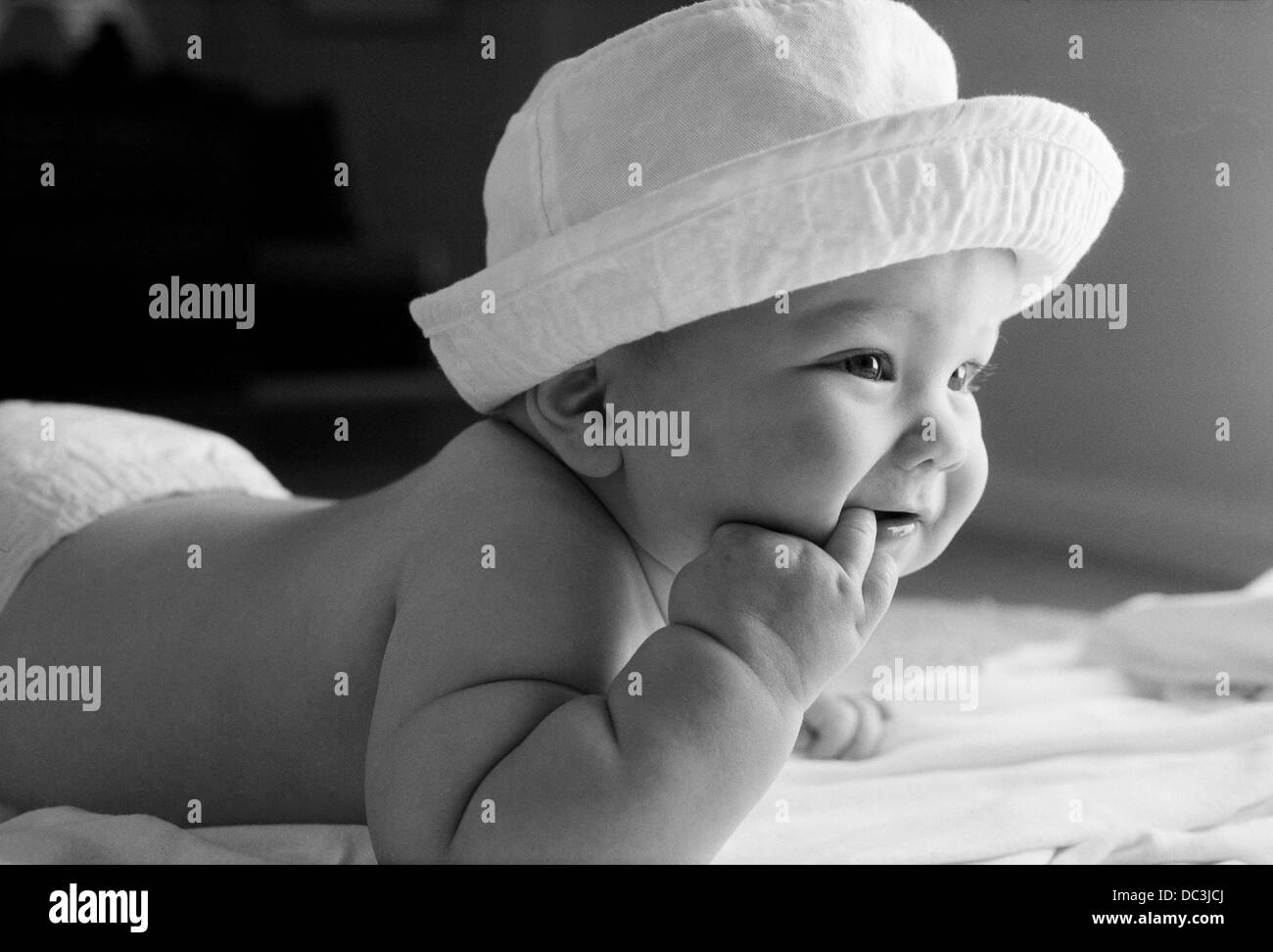 Baby with hat Stock Photo - Alamy