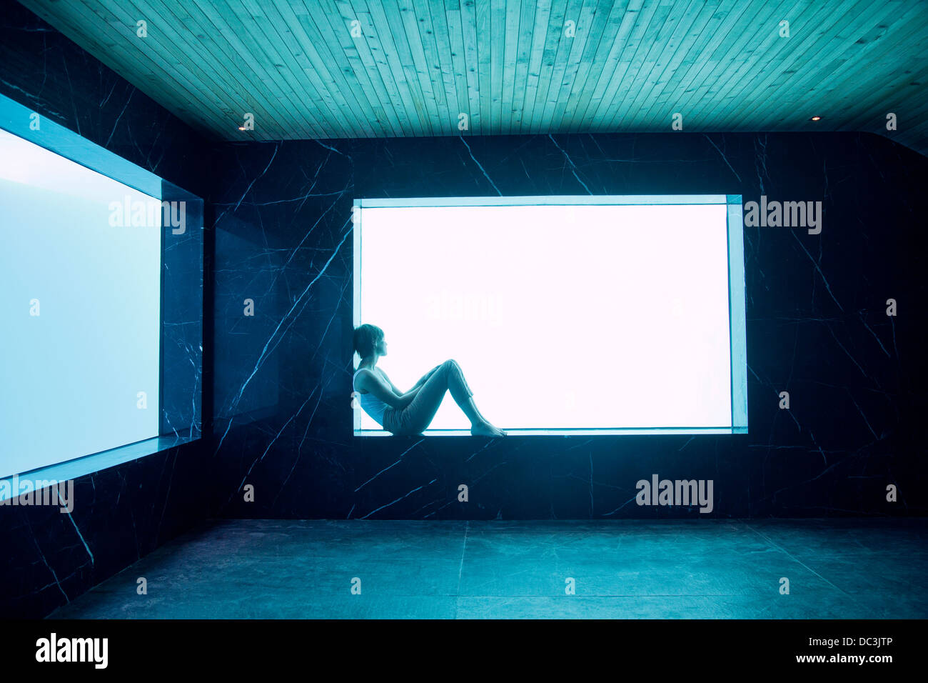 Woman sitting luxury home hi-res stock photography and images - Alamy