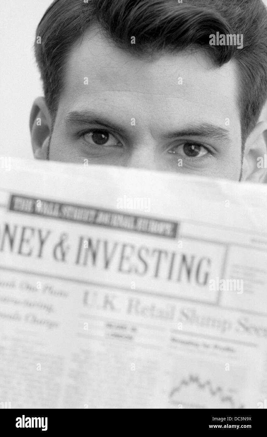 Hiding behind newspaper hi-res stock photography and images - Alamy
