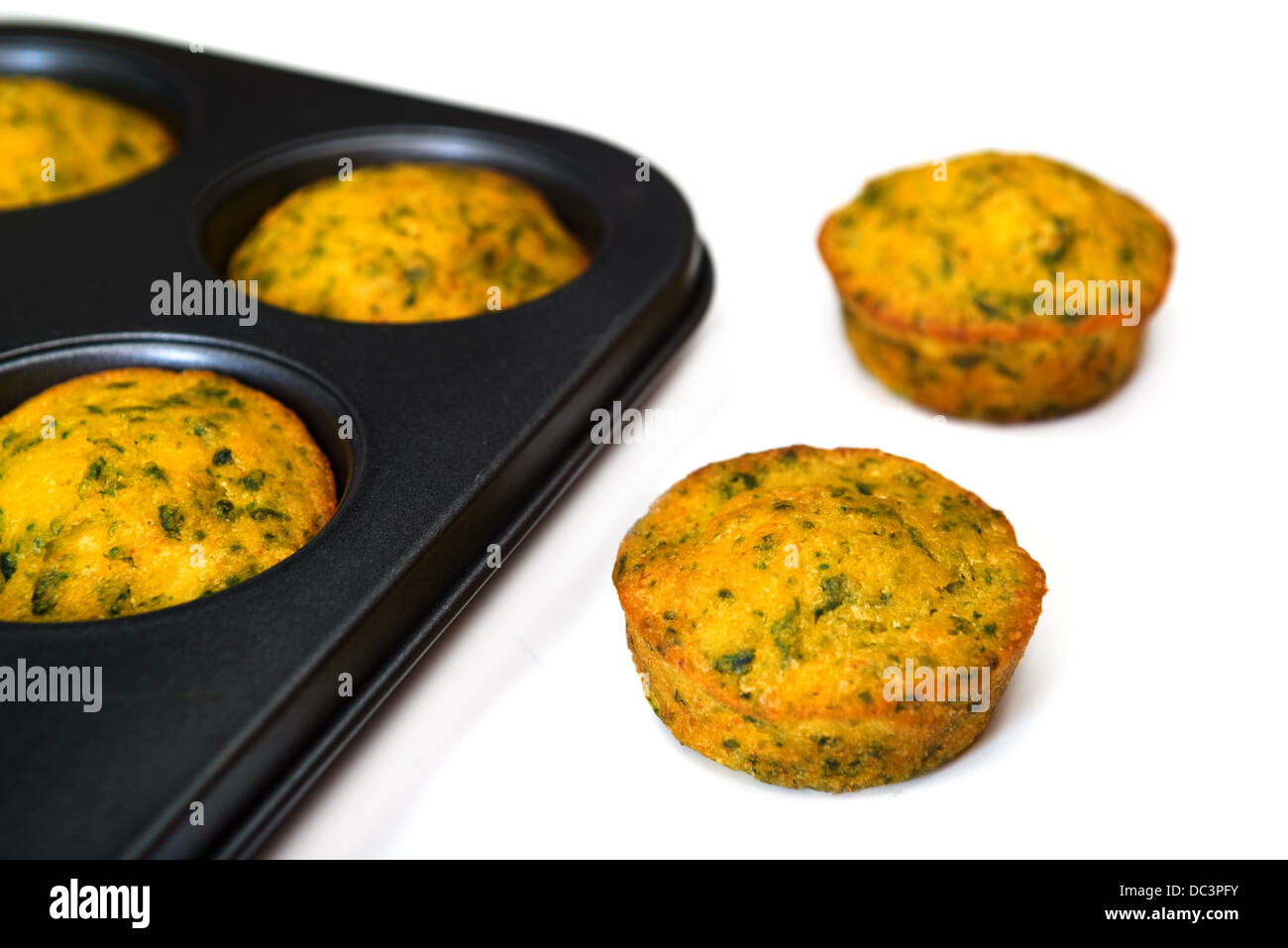 Pie mold with spinach pies over a white background Stock Photo - Alamy