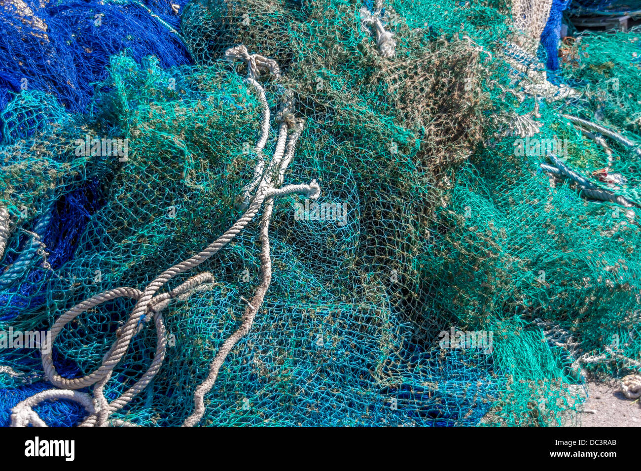 Turquoise fishermans nets on quayside hi-res stock photography and ...